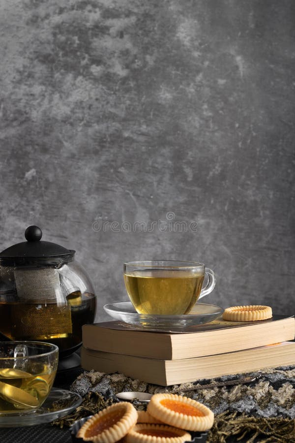 Relaxing Tea Time Concept. Dark Mood View of Herbal Tea and Cookies ...