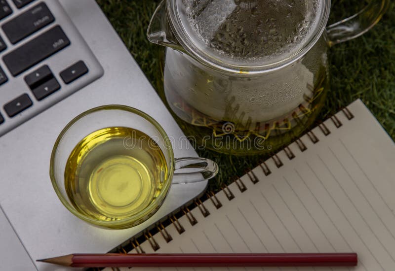 Relaxing Time with a Cup of Tea. Workplace Area with Laptop, Tea Cup ...