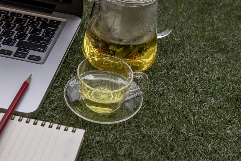 Relaxing Time with a Cup of Tea. Workplace Area with Laptop, Tea Cup ...