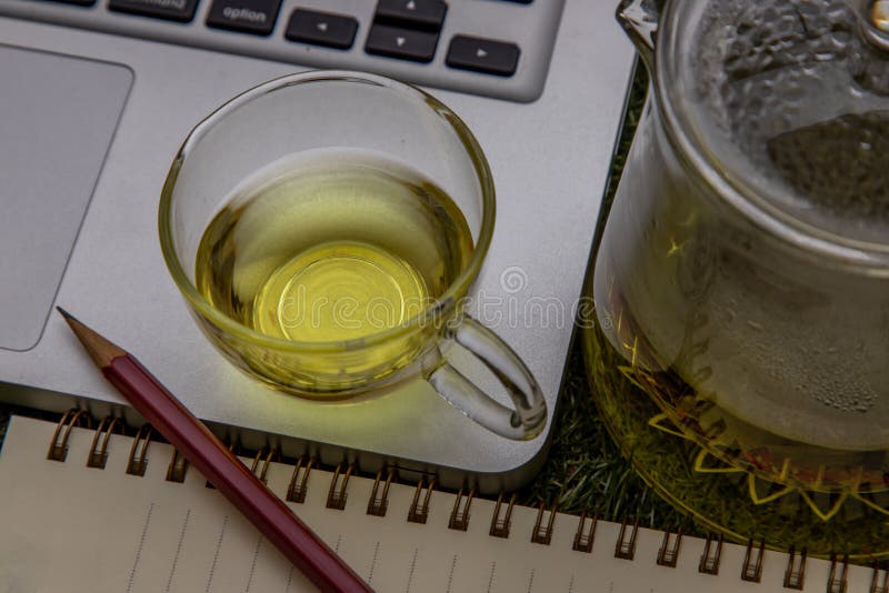 Relaxing Time with a Cup of Tea. Workplace Area with Laptop, Tea Cup ...