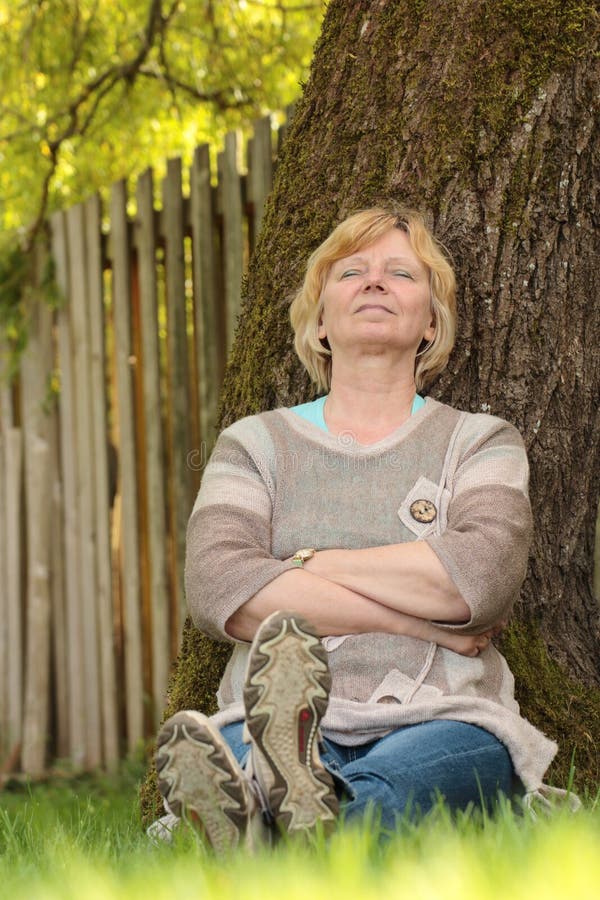 Relaxing under tree stock image. Image of woman, resting - 53560527