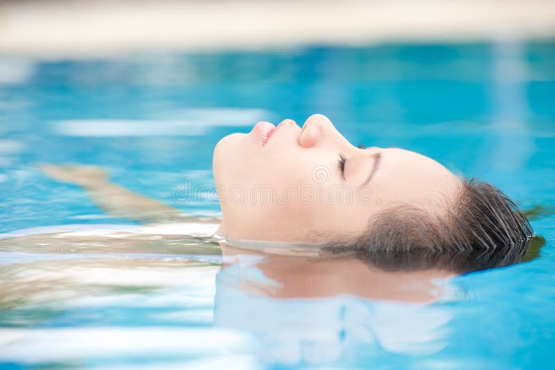 Enjoy the Summer. Woman Relaxing in the Pool Water Stock Image - Image ...