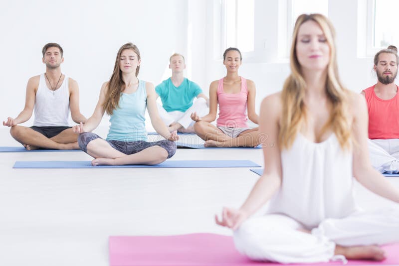 Relaxing Yoga Exercises at Gym Stock Image - Image of physical, fitness ...