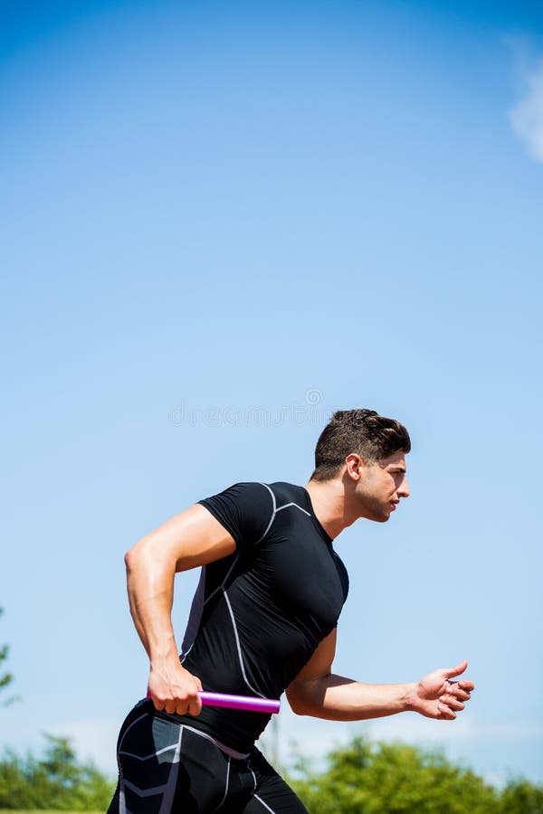 Relay Baton on Running Track Stock Image - Image of multi, racing: 74026113