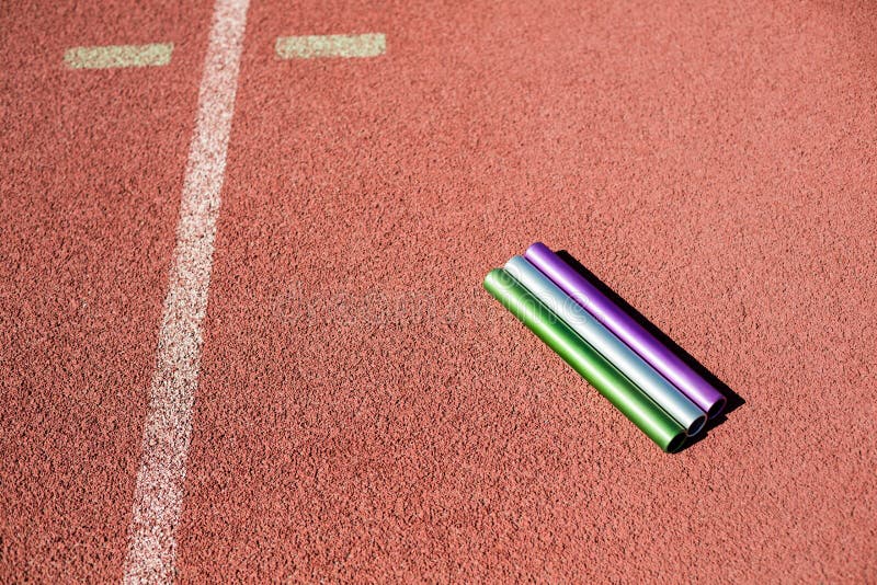 Relay Baton on Running Track Stock Image - Image of multi, racing: 74026113