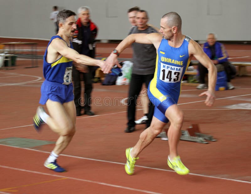 Boys run relay race editorial stock image. Image of athletes - 23599819