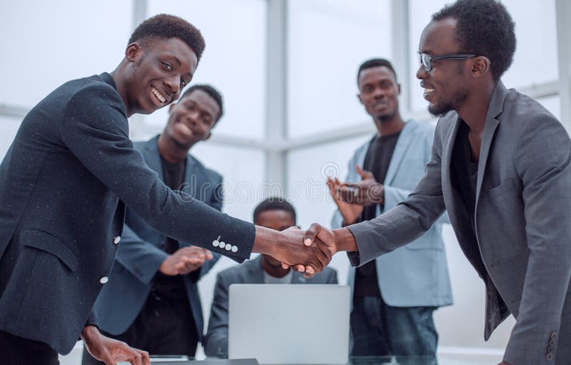 Reliable Handshake of Business Partners Over the Desktop. Stock Photo ...