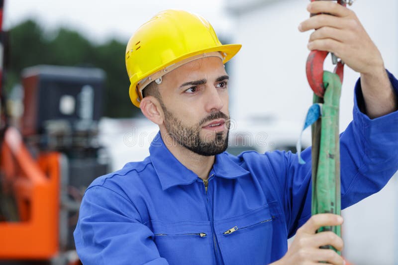 Reliable Young Worker Checking Safety Latch Hook Stock Photo - Image of ...