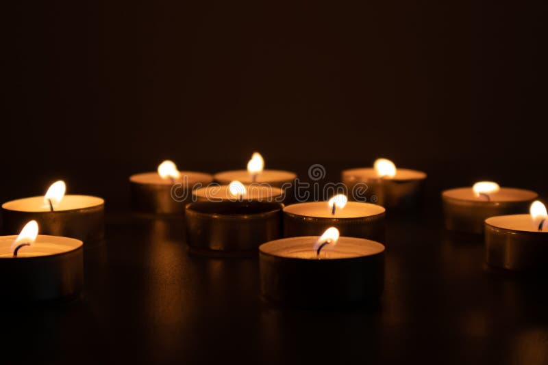 Religious and Devoutness Scene: Candles Burning in the Dark Stock Photo ...