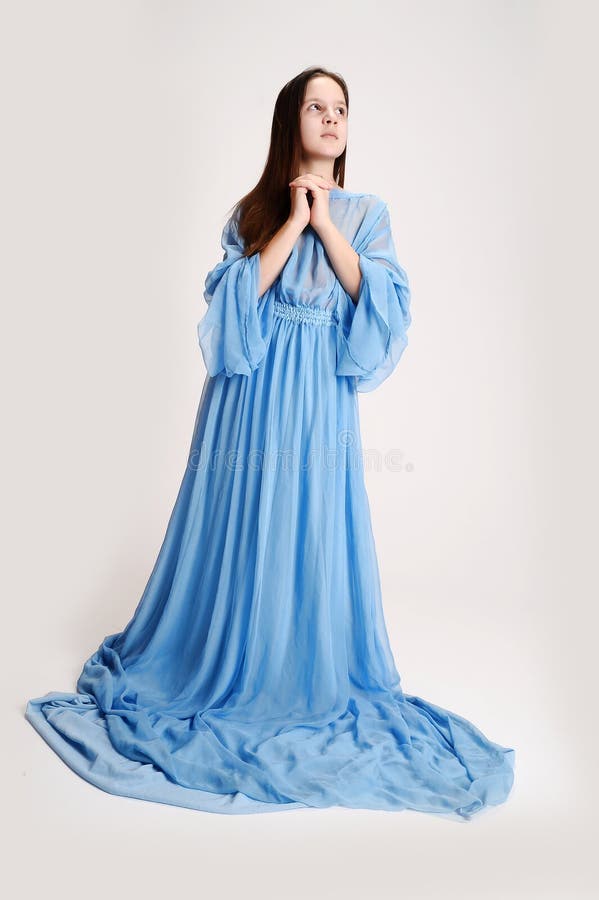 Religious Girl in a Blue Dress Stock Image - Image of belief, hope ...