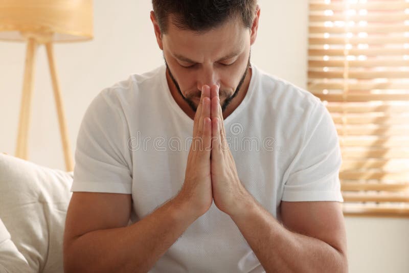 Religious Man with Clasped Hands Praying Indoors Stock Image - Image of ...
