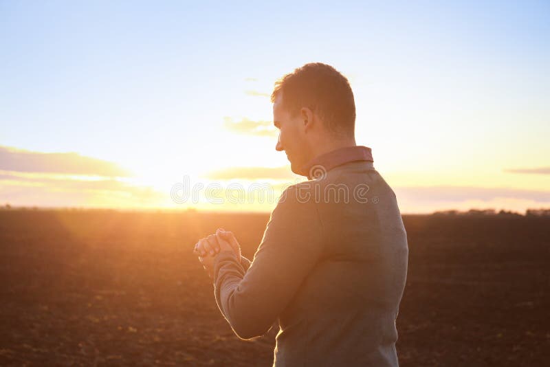 Religious Man Praying Outdoors at Sunset Stock Image - Image of pray ...