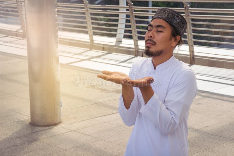 Religious Muslim Man Praying in City Stock Photo - Image of headscarf ...