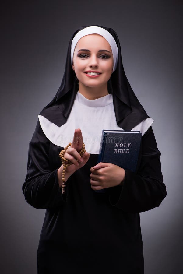 The Religious Nun in Religion Concept Against Dark Background Stock ...