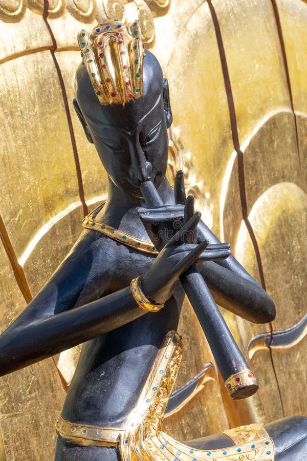 Religious Statue Playing on Instrument Stock Photo - Image of design ...