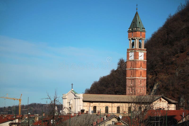 Religious Tower with Golden Cupola Under Blue Sky with Tree Alley in ...