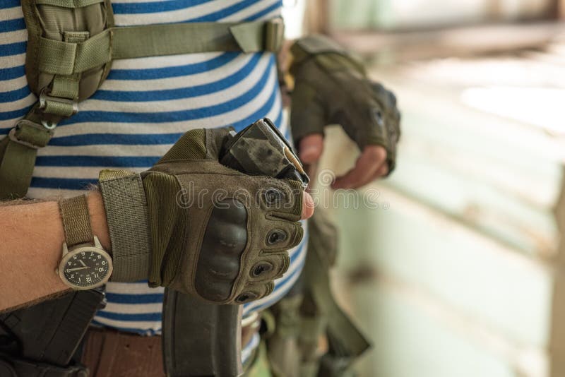 Reloading a Clip from a Machine Gun Close-up. Stock Photo - Image of ...