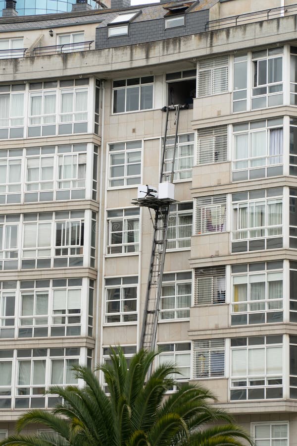 Relocation Service on Building. Lifting Platform with Boxes Working on ...