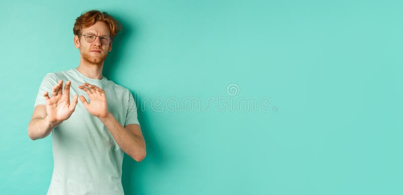 Reluctant Redhead Man In Glasses Raising Hands In Refusal Gesture Step