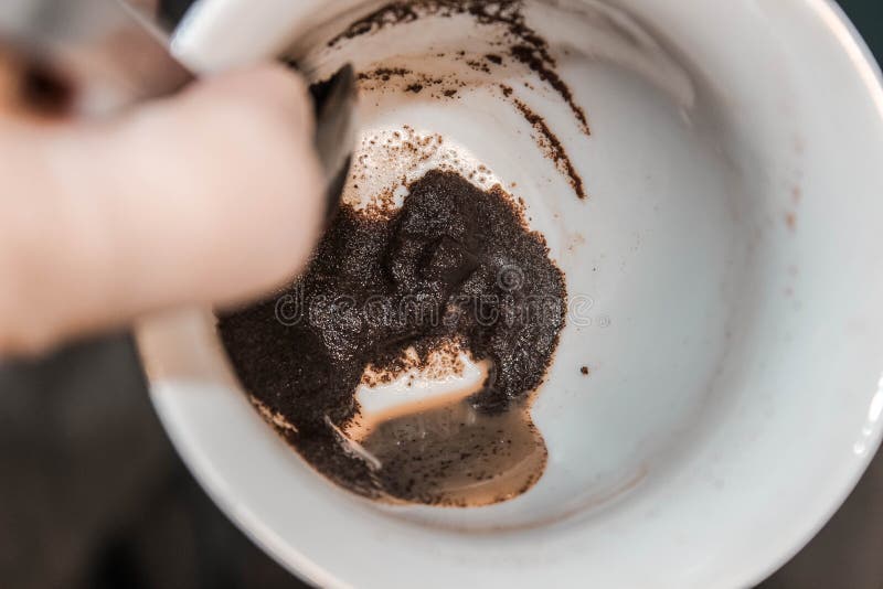 The Remains of Coffee and Coffee Grounds in a Mug with a Finished Drink ...