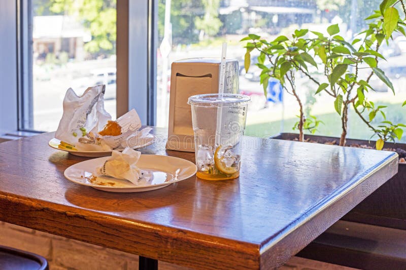 Remains of Food and Garbage after it on the Table in a Cafe. Stock ...