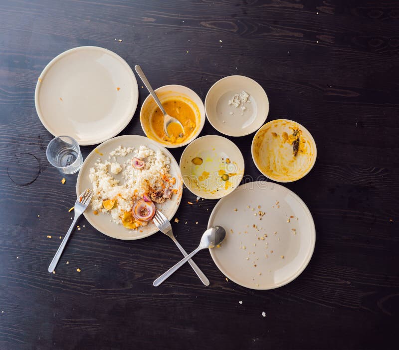 The Remains of Food in Plates, Crumbs on the Table after Lunch or ...