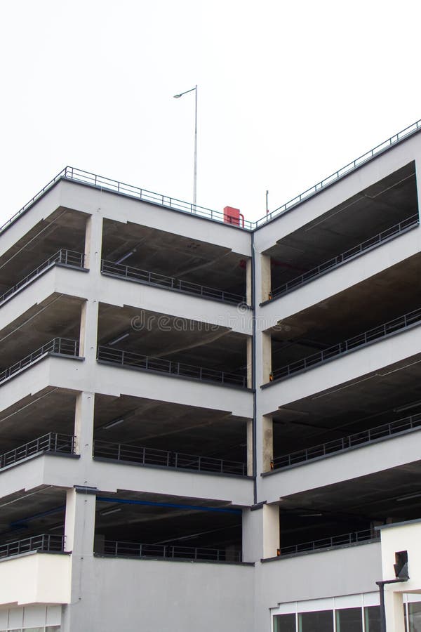 A Remarkably Tall Building that Features Numerous Levels and Balconies ...