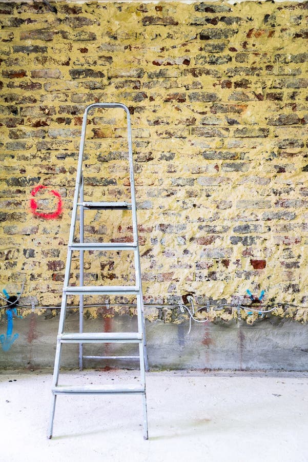 Remediation of Brick Wall and Ladder Stock Image - Image of renewal ...