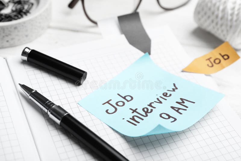 Reminder Note about Job Interview and Stationery on Table Stock Photo ...