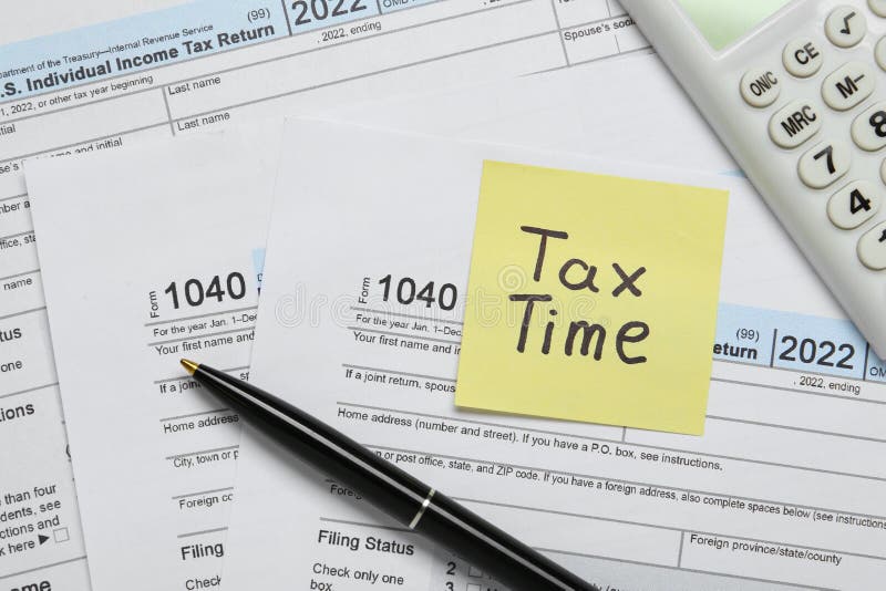 Reminder Note with Words Tax Time, Calculator and Pen on Documents ...