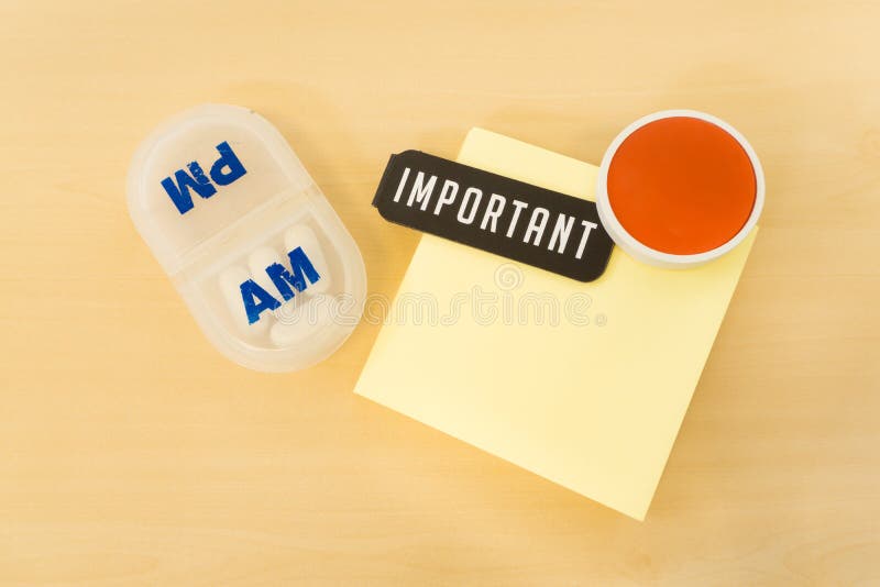 Reminder Pill Box with Important Word and Big Red Smile on Yello Stock ...