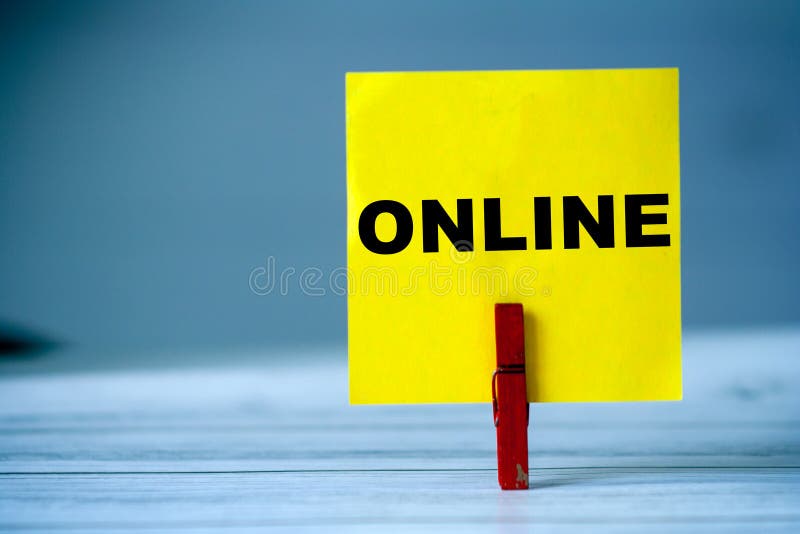 Reminder Sticky Note with Clothes Pin on Table. Sticky Note with ...