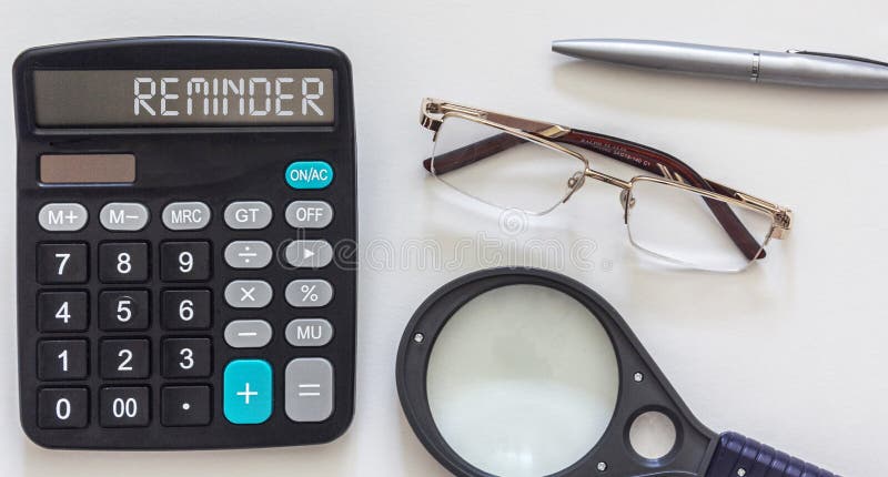 REMINDER Text on a Calculator with a Magnifying Glass, Glasses and a ...