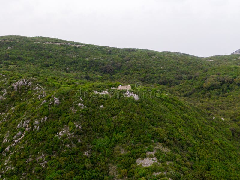 Remote Building Nestled Amidst Lush Green Mountain Forest Stock Image ...