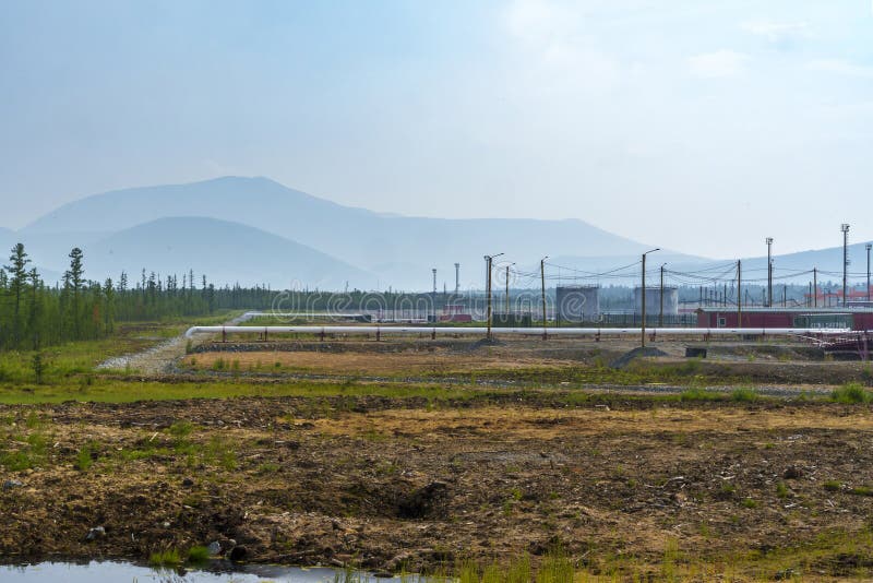 Remote Construction Site with Dirt Road and Distant Mountains Stock ...