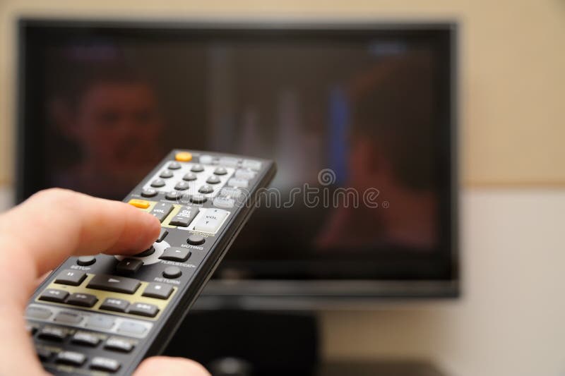 Watching TV and Using Black Modern Remote Controller. Hand Holding TV ...