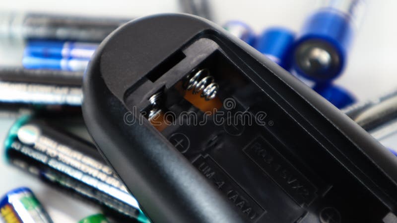 Remote Control Amid Scattered Disposable AAA and AA Alkaline Batteries ...