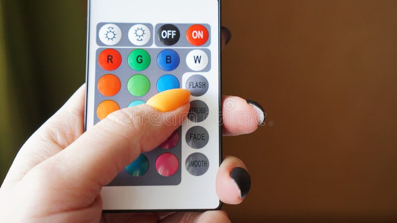 Remote Control for Change Colors in Hand Stock Photo - Image of button ...