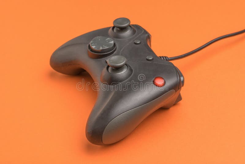 Remote Control for Computer Games on an Orange Background Stock Photo ...