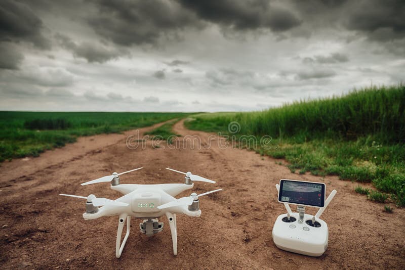 Remote Control and Drone on a Green Field Stock Image - Image of green ...