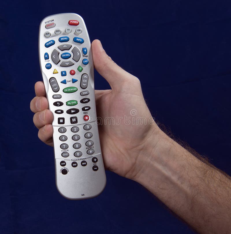 Remote Control in Hand with Blue Background Stock Photo - Image of ...