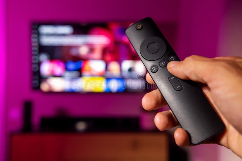 Remote Control in Hand with Tv in Background. Streaming Service ...