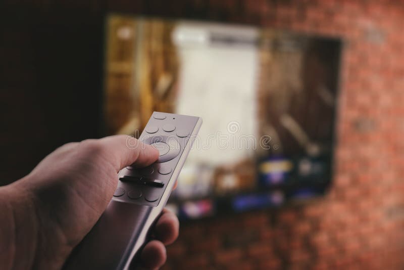 Remote Control in Hand and Tv on the Wall Stock Image - Image of film ...