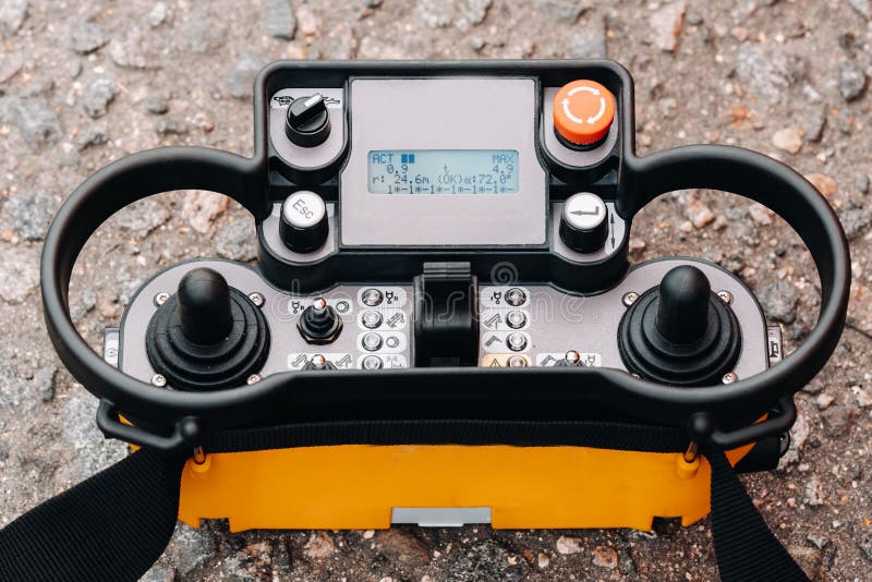 Remote Control of a Lifting Car Crane. Panel with Joysticks and Buttons ...