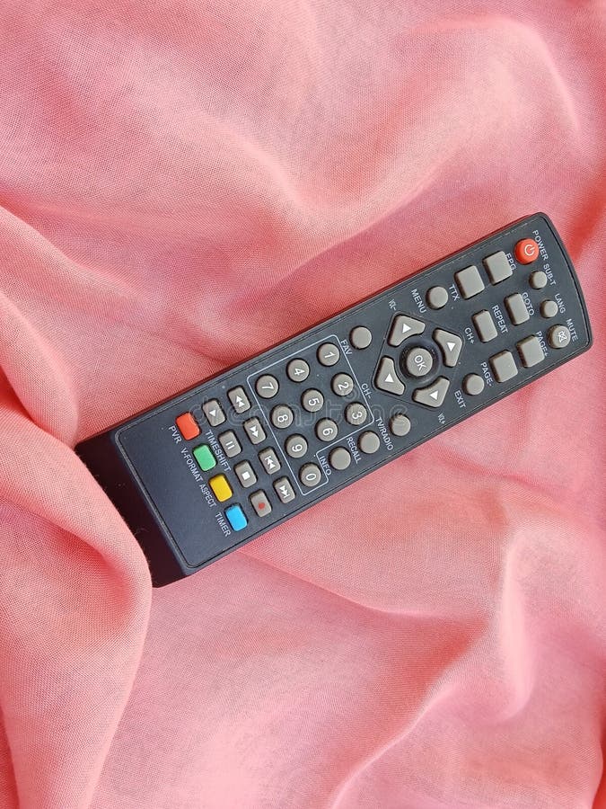 A Remote Control on a Pink Cloth Stock Photo - Image of object ...