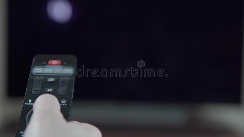 The Remote Control Switches the TV Channels and Controls the Volume ...