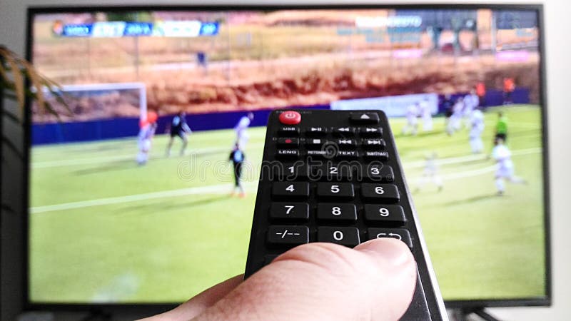 Remote Control Watching TV in Background Stock Image - Image of match ...