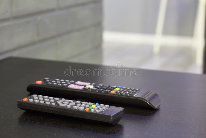 Remote Controller at the Table in Front of the TV Stock Image - Image ...