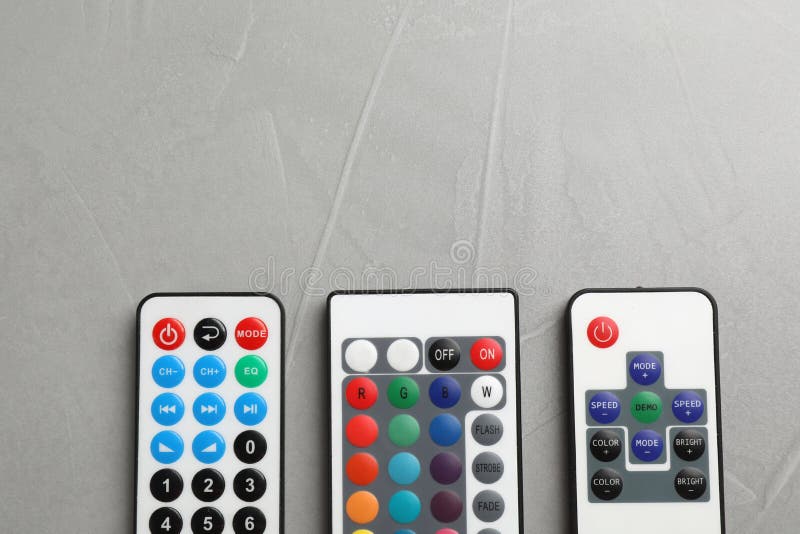 Remote Controls on Grey Table, Flat Lay. Space for Text Stock Image ...