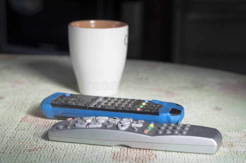 Remote Controls and Mug stock image. Image of dirty, entertainment ...